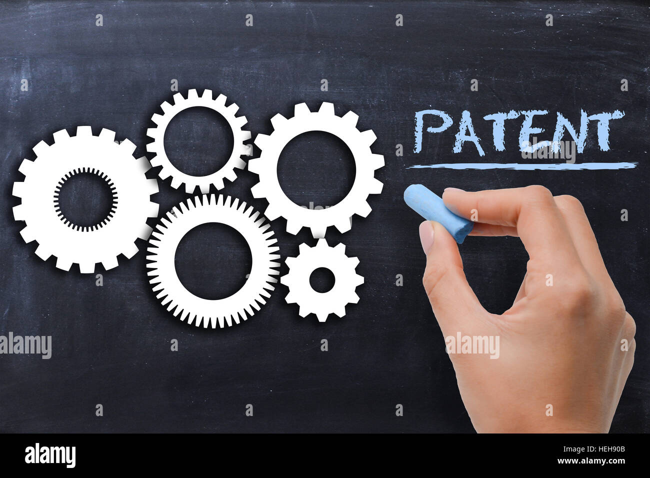 Industrial patent protection concept with gears on blackboard Stock ...
