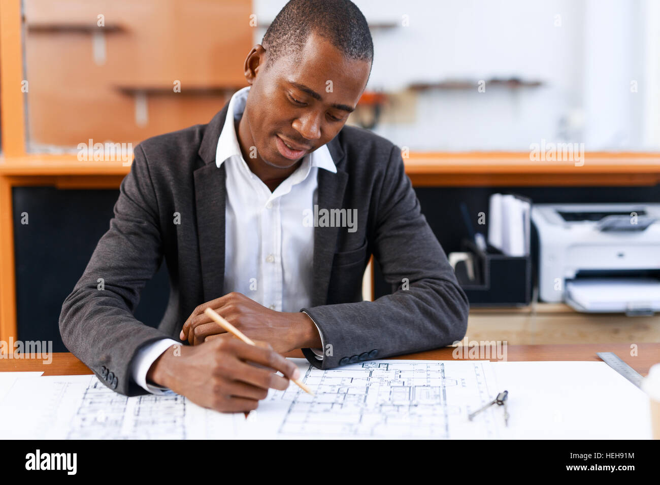 Young engineer drafting at workplace in office Stock Photo - Alamy