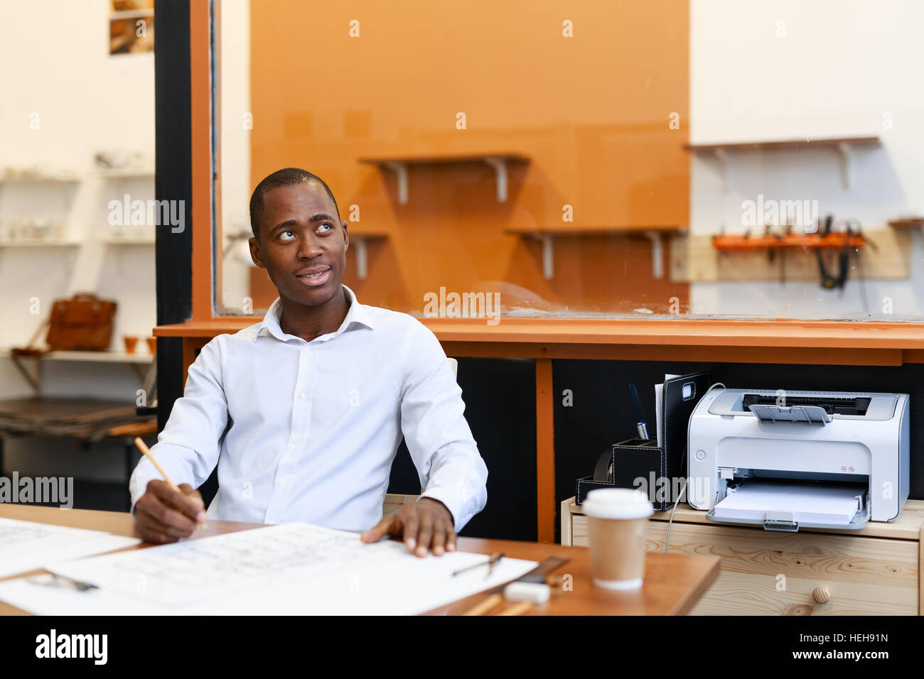 Young engineer thinking of new ideas at workplace Stock Photo - Alamy