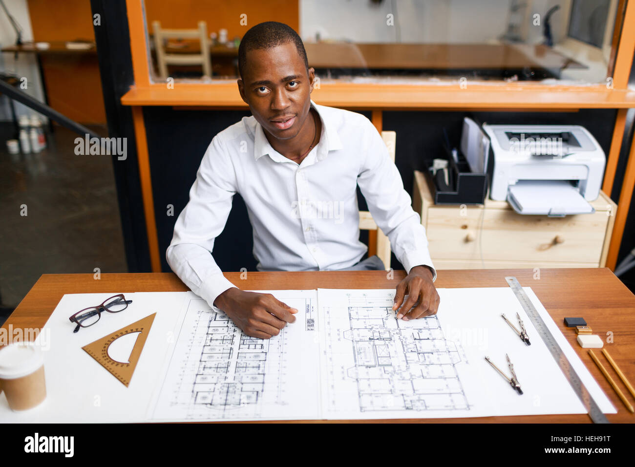 Engineering professional looking at camera during work Stock Photo - Alamy