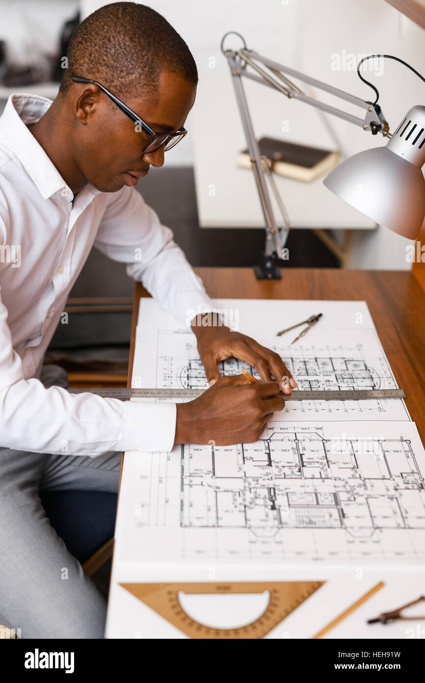 Modern architect making plan of new construction Stock Photo - Alamy