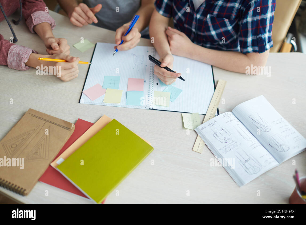 Students making notes on notepaper before or after lesson Stock Photo ...