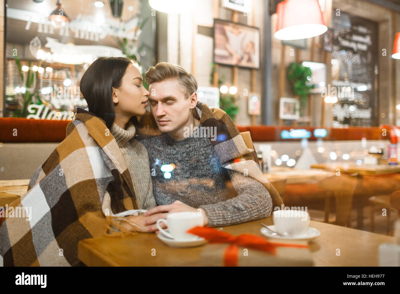 Amorous dates taking pleasure by relax in cafe Stock Photo - Alamy