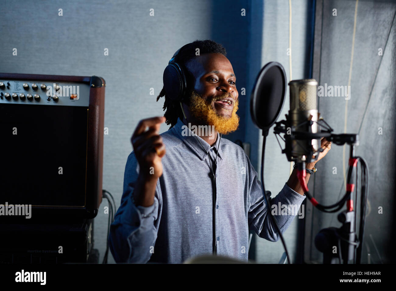 Young pop-singer recording new music album in studio Stock Photo - Alamy