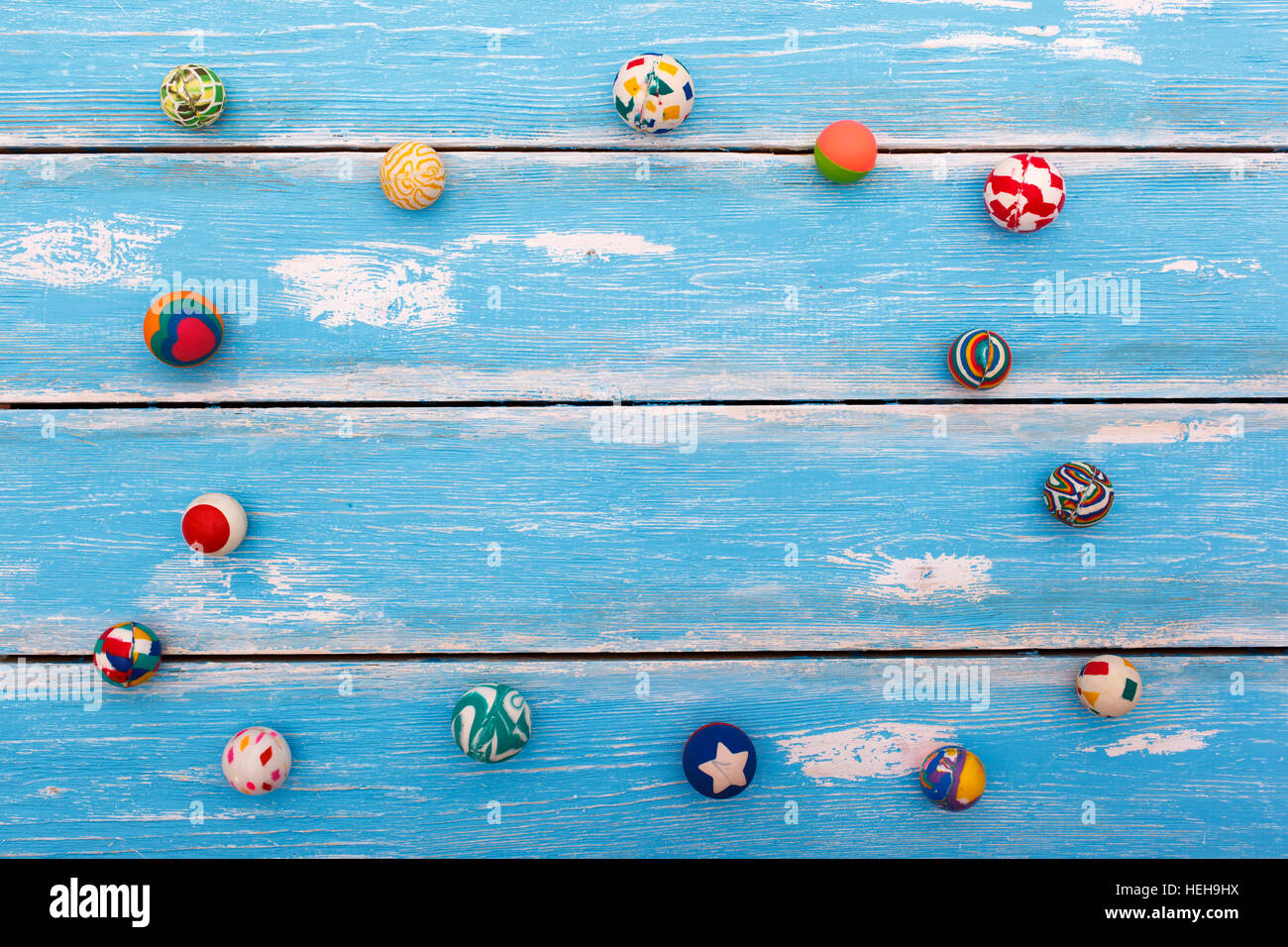 Collection of rubber bounce balls on wooden blue background Stock Photo ...