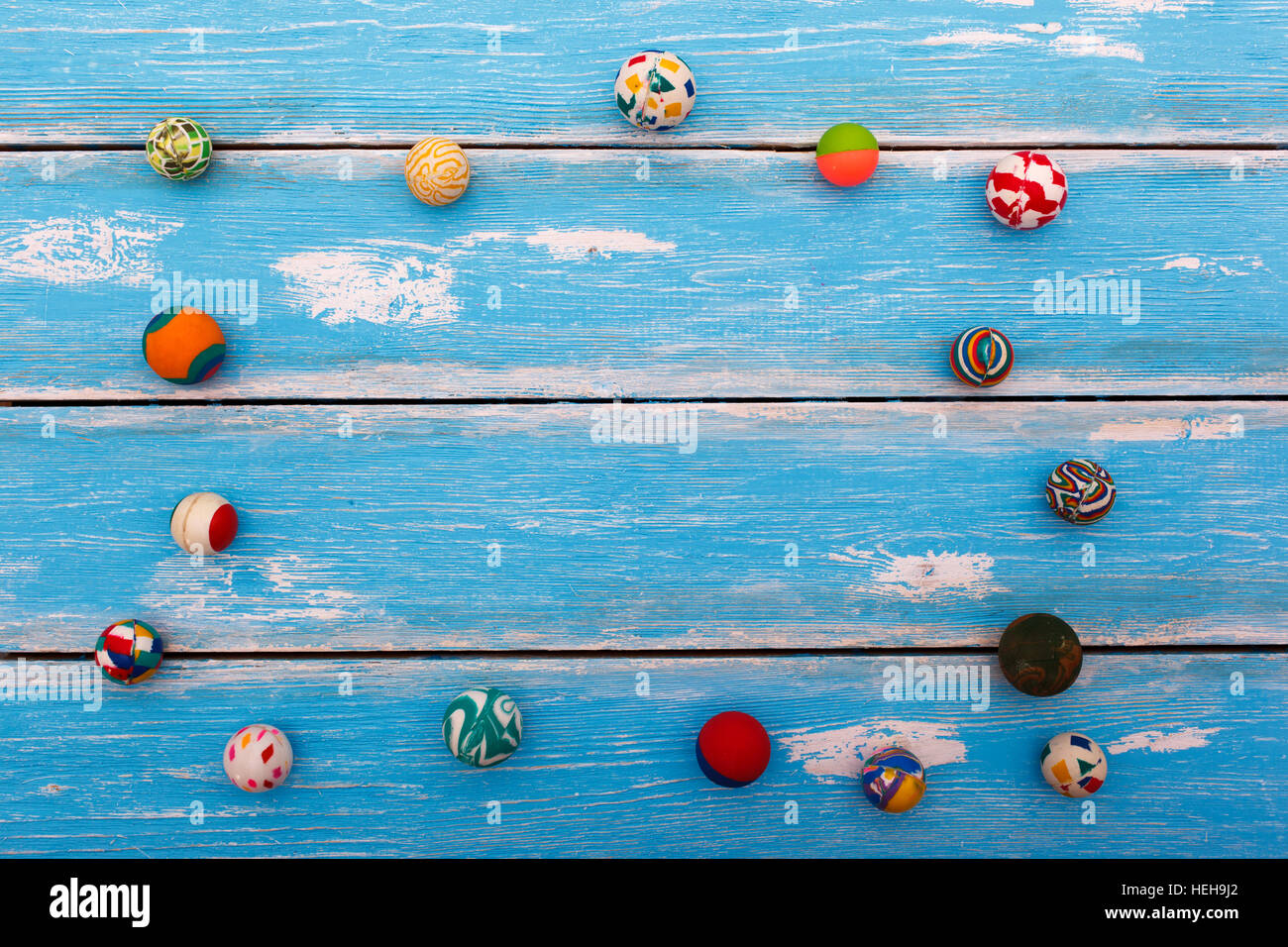 Collection of rubber bounce balls on wooden blue background Stock Photo ...