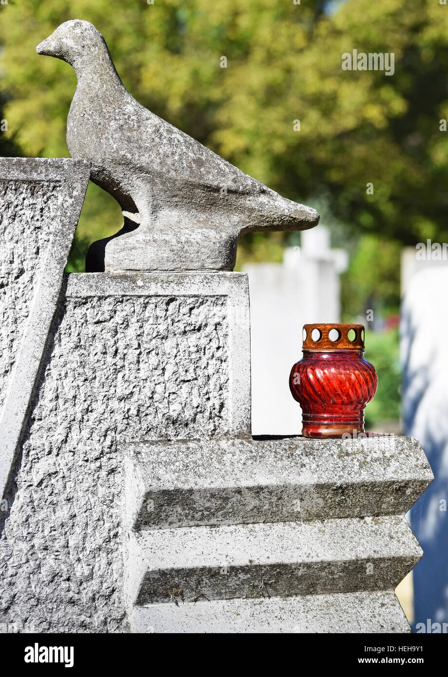 Dove and lantern on the tombstone in the public cemetery Stock Photo - Alamy