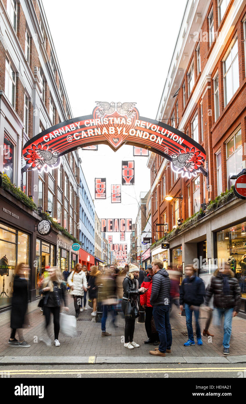 'Carnaby Christmas Revolution' and tourists on Carnaby Street, London ...