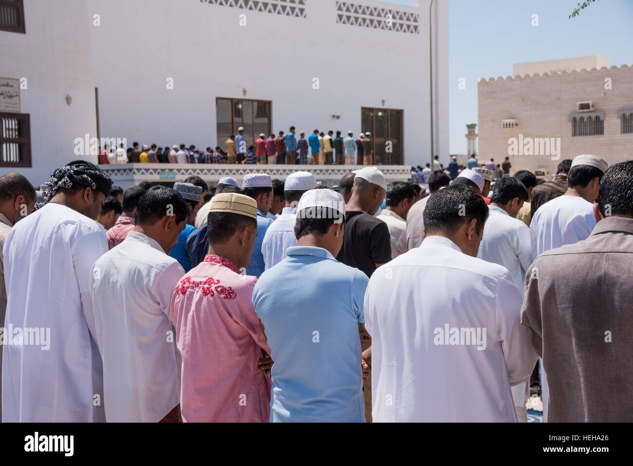 Men gathered for Friday prayer outside the Masjid Aqeel Mosque in ...