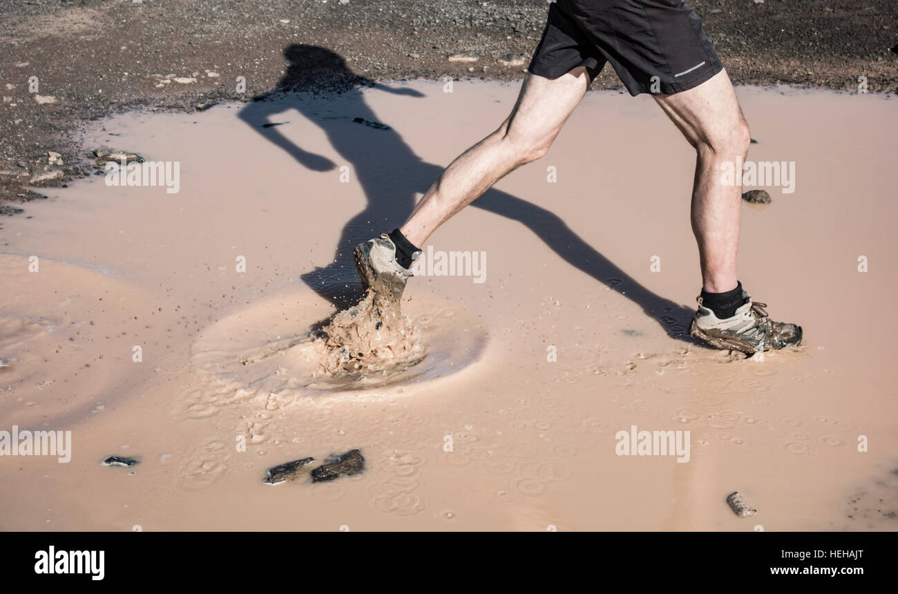Feet running through puddle hi-res stock photography and images - Alamy