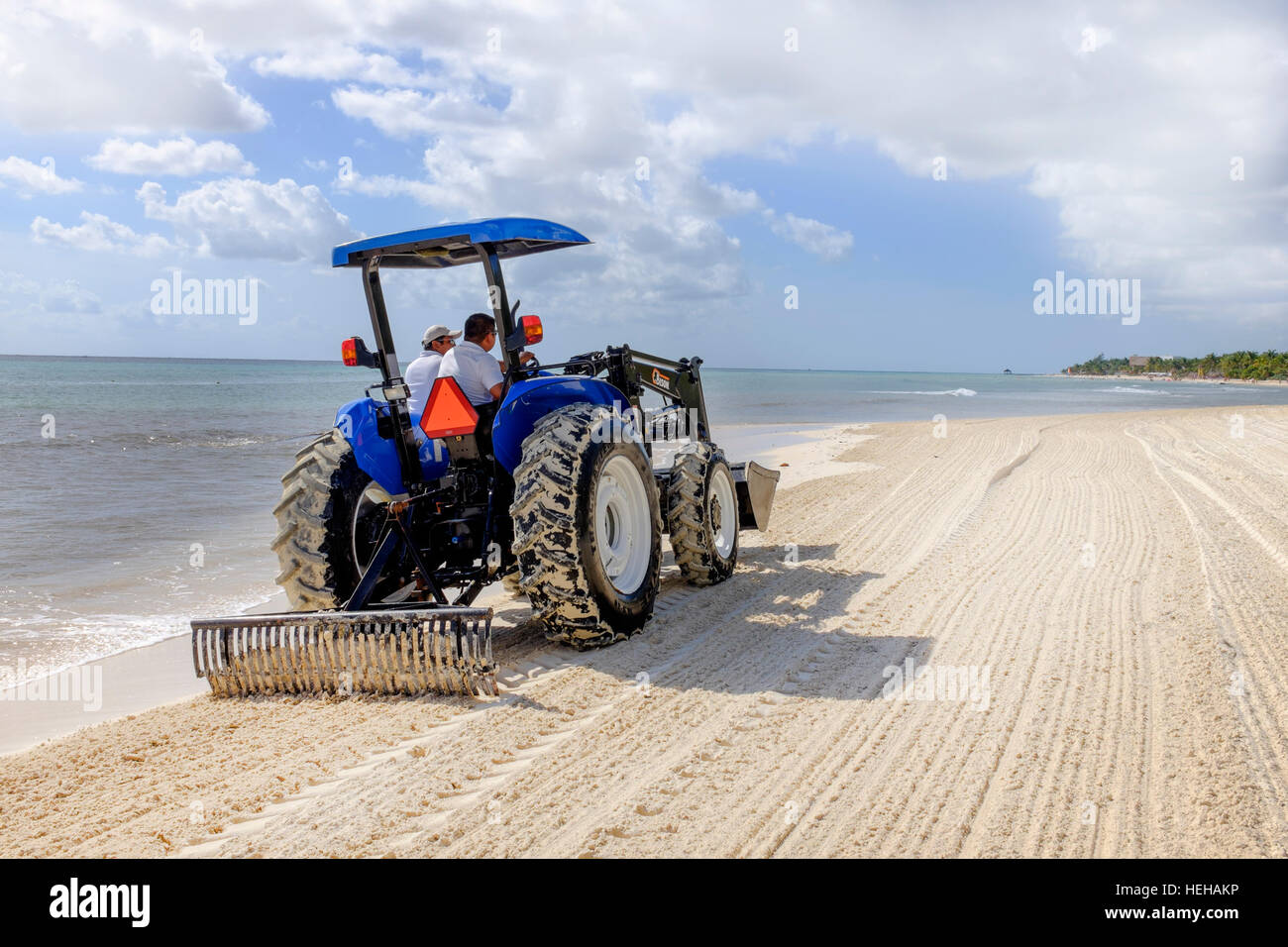 Tractor raking a beach at Playa Del Carmen, near Cancun, Mexico to ...
