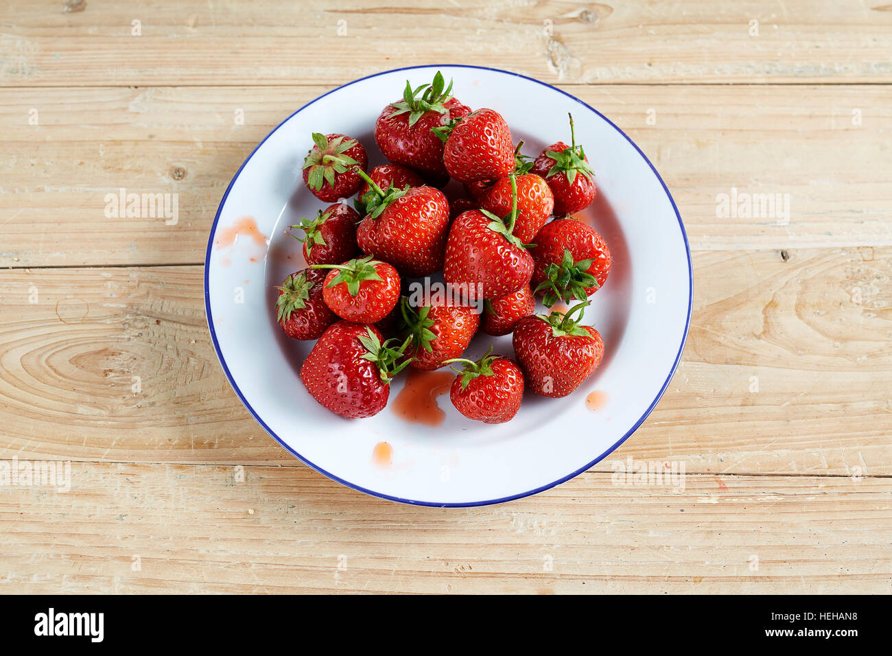 strawberries fruit red portion stalks fresh picked white skin pale ...