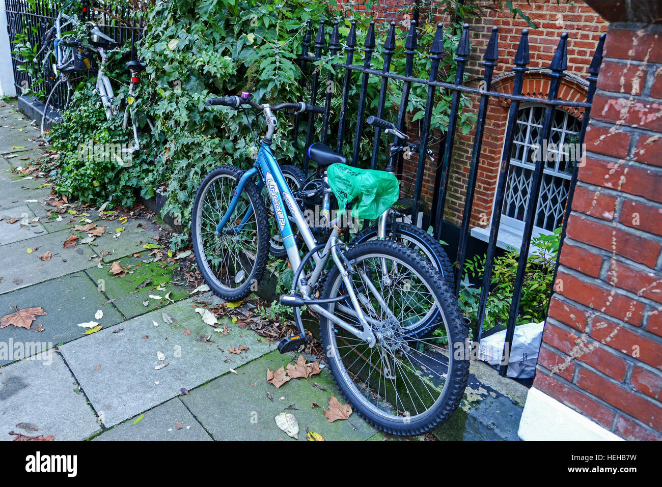 Bicycles chained to railings Stock Photo - Alamy