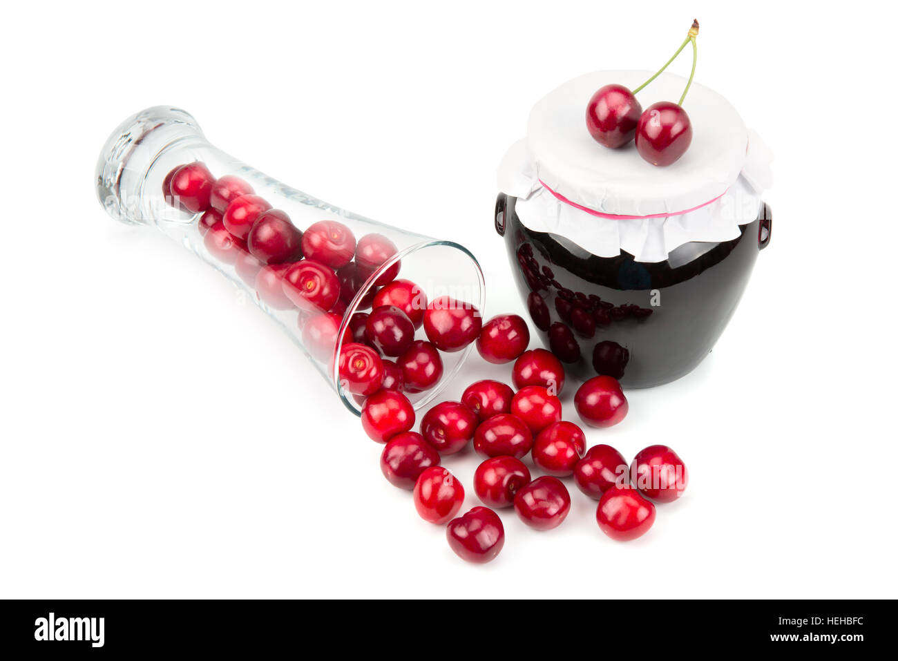 Cherry jam and cherries isolated on white background Stock Photo - Alamy