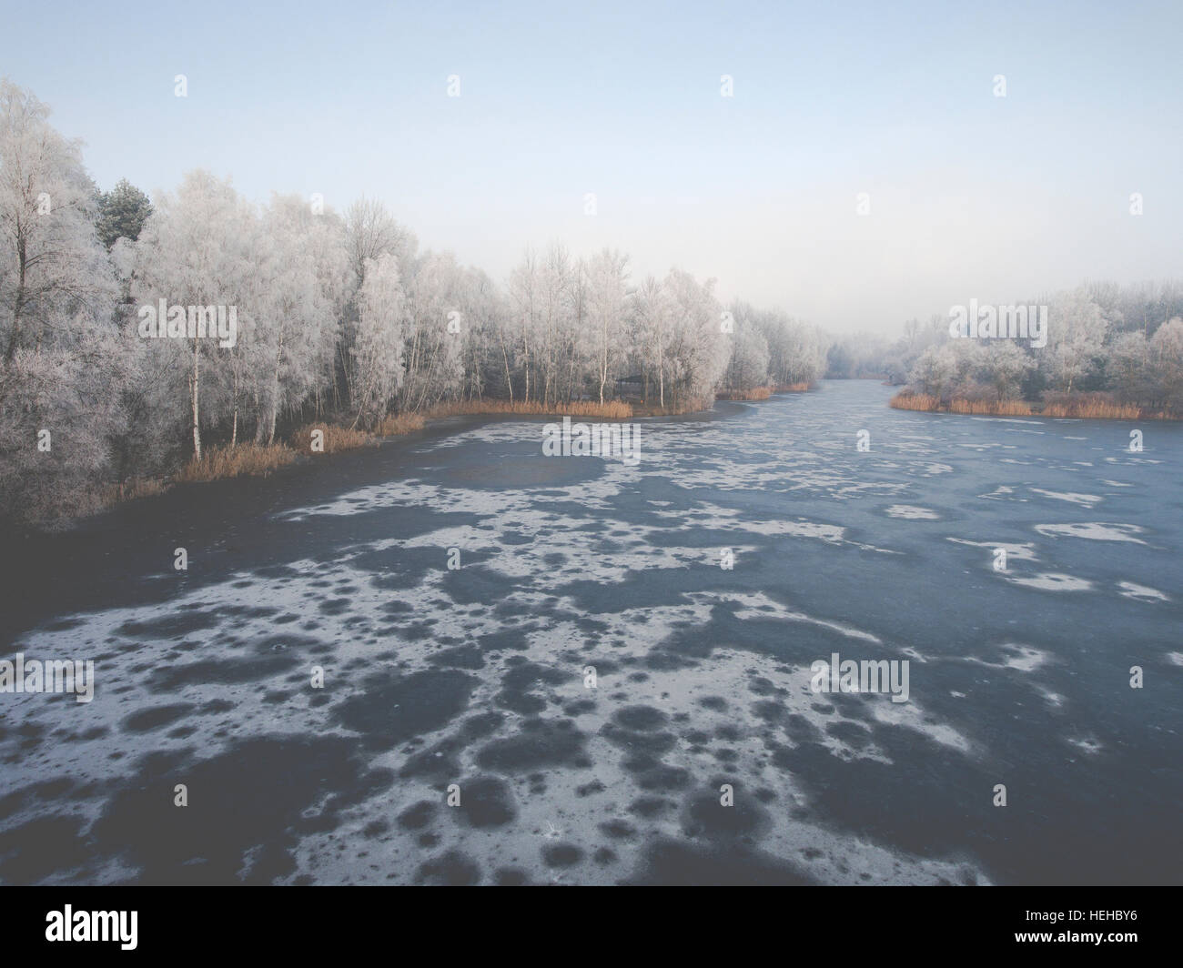 Aerial view of the winter background with a snow-covered forest and ...