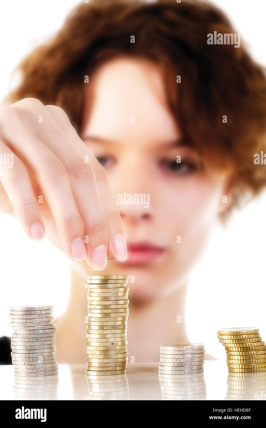 Young woman stacking coins Stock Photo - Alamy
