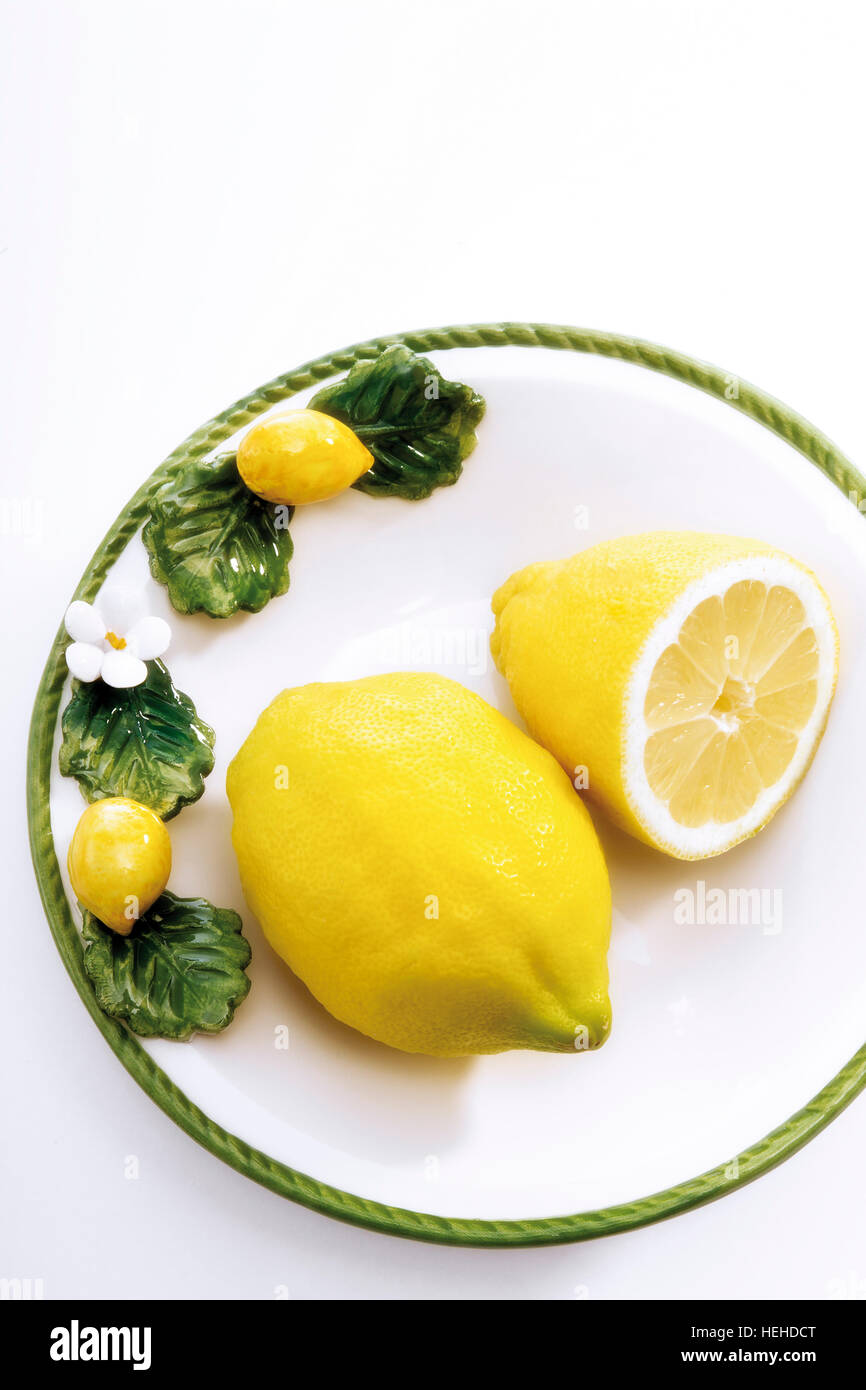Lemons on a plate Stock Photo - Alamy