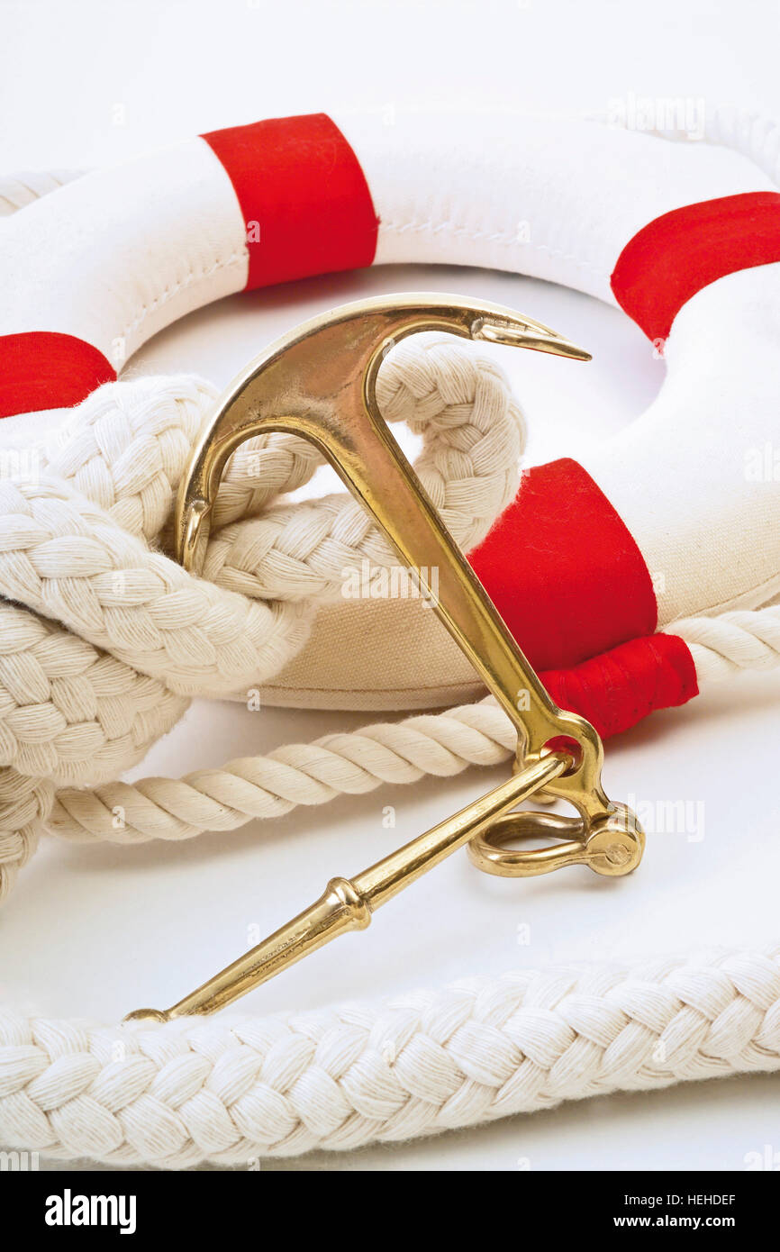 Golden anchor, ship's knot and lifesaver Stock Photo - Alamy