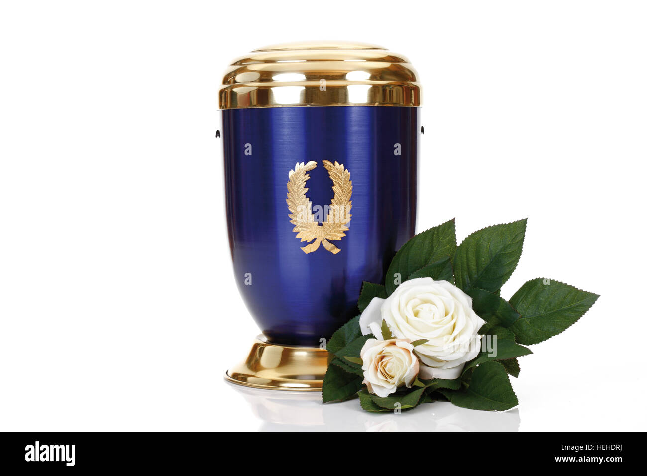 White roses in front of a blue urn Stock Photo - Alamy
