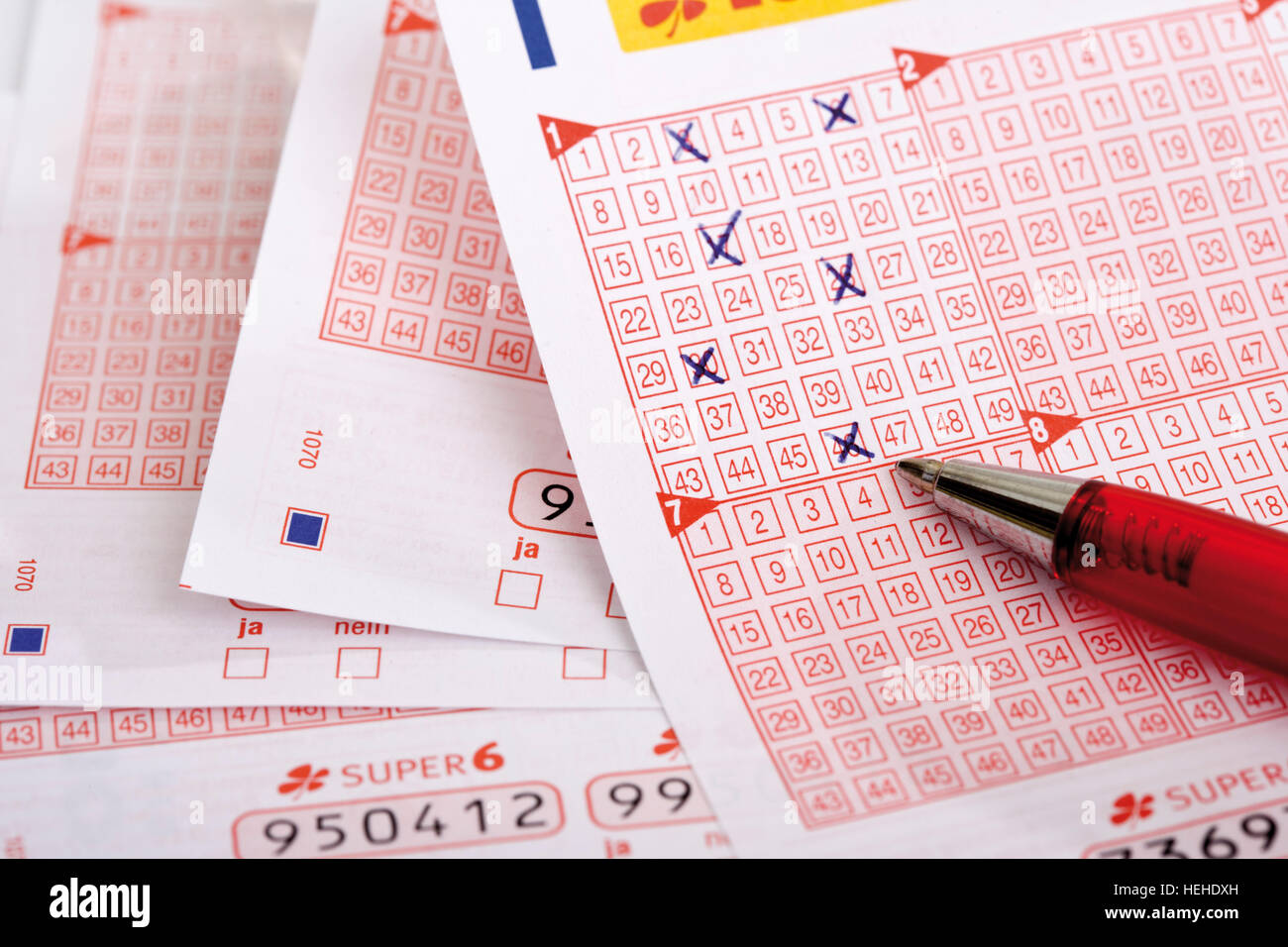 Lottery tickets with pen Stock Photo - Alamy