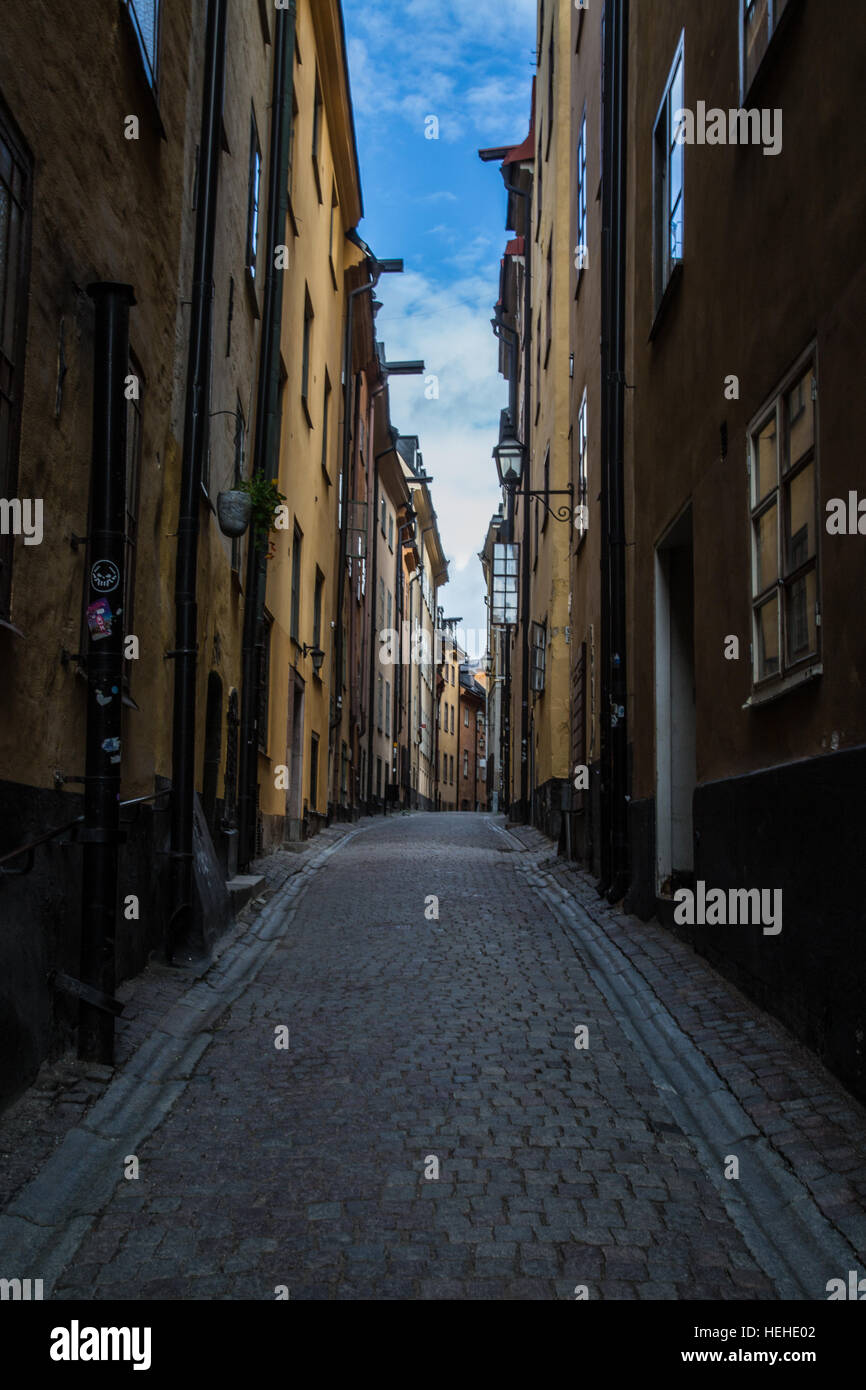 A narrow alley in Gamla Stan, Stockholm, Sweden, with red, yellow and ...