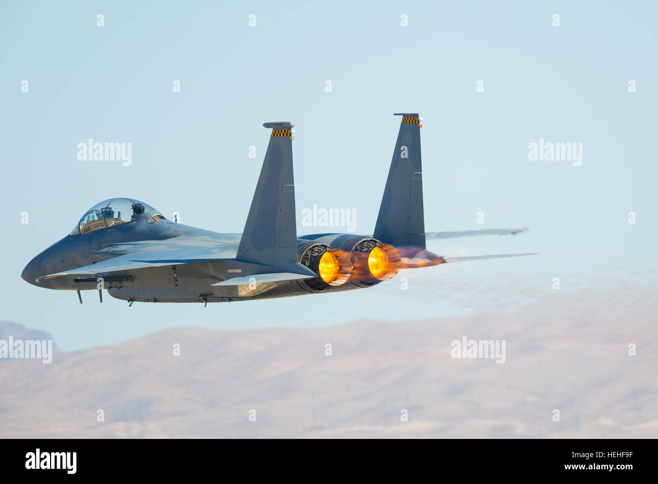 F-15 Eagle against the Nevada hills, with afterburner on Stock Photo ...