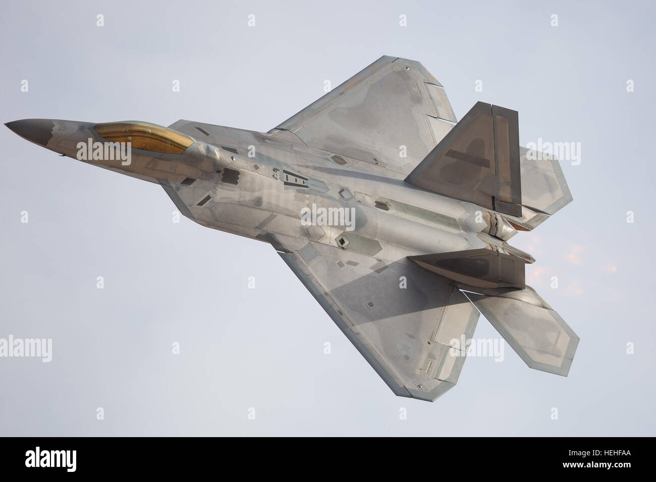F-22 Raptor in a turn, with afterburner on Stock Photo - Alamy