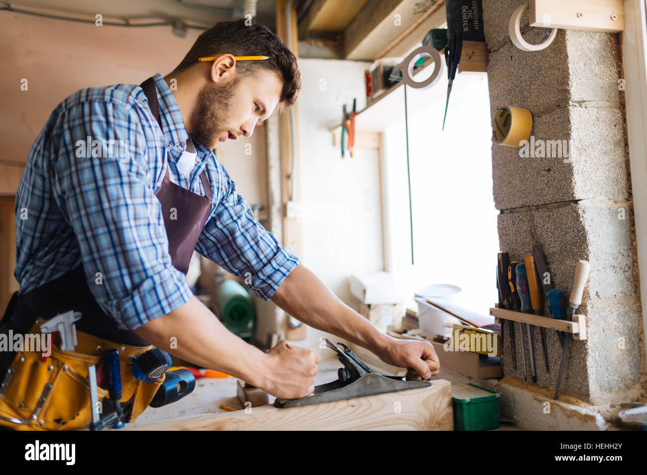Craftsman working with wood in his workshop Stock Photo - Alamy