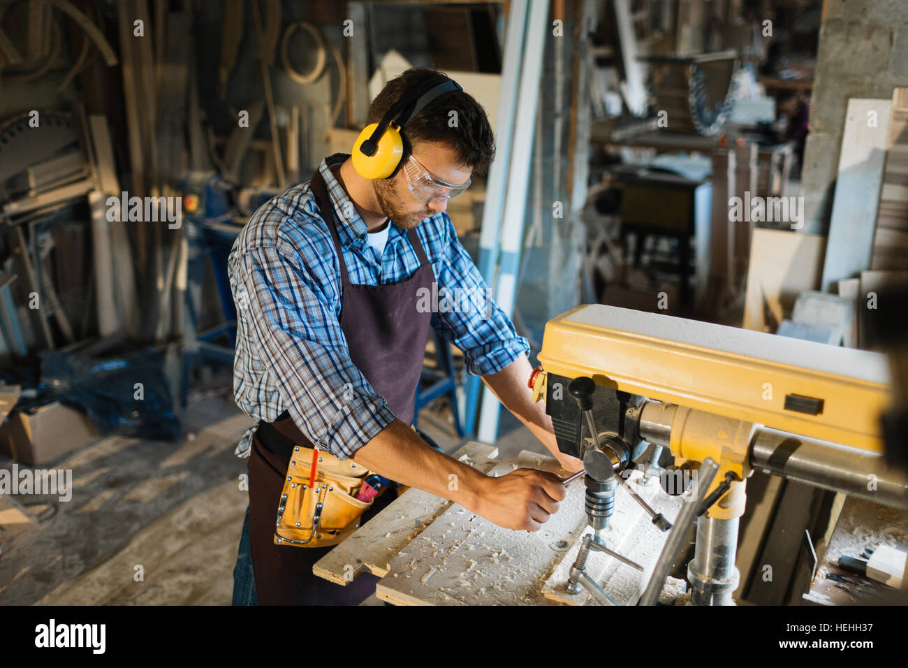 Owner of manufacturing business working on drill machine Stock Photo ...