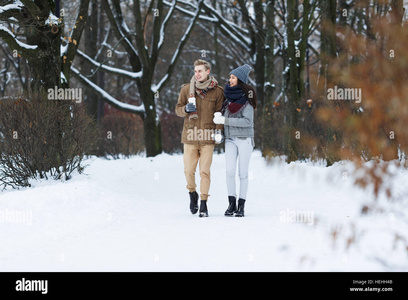Happy young dates walking in park Stock Photo - Alamy