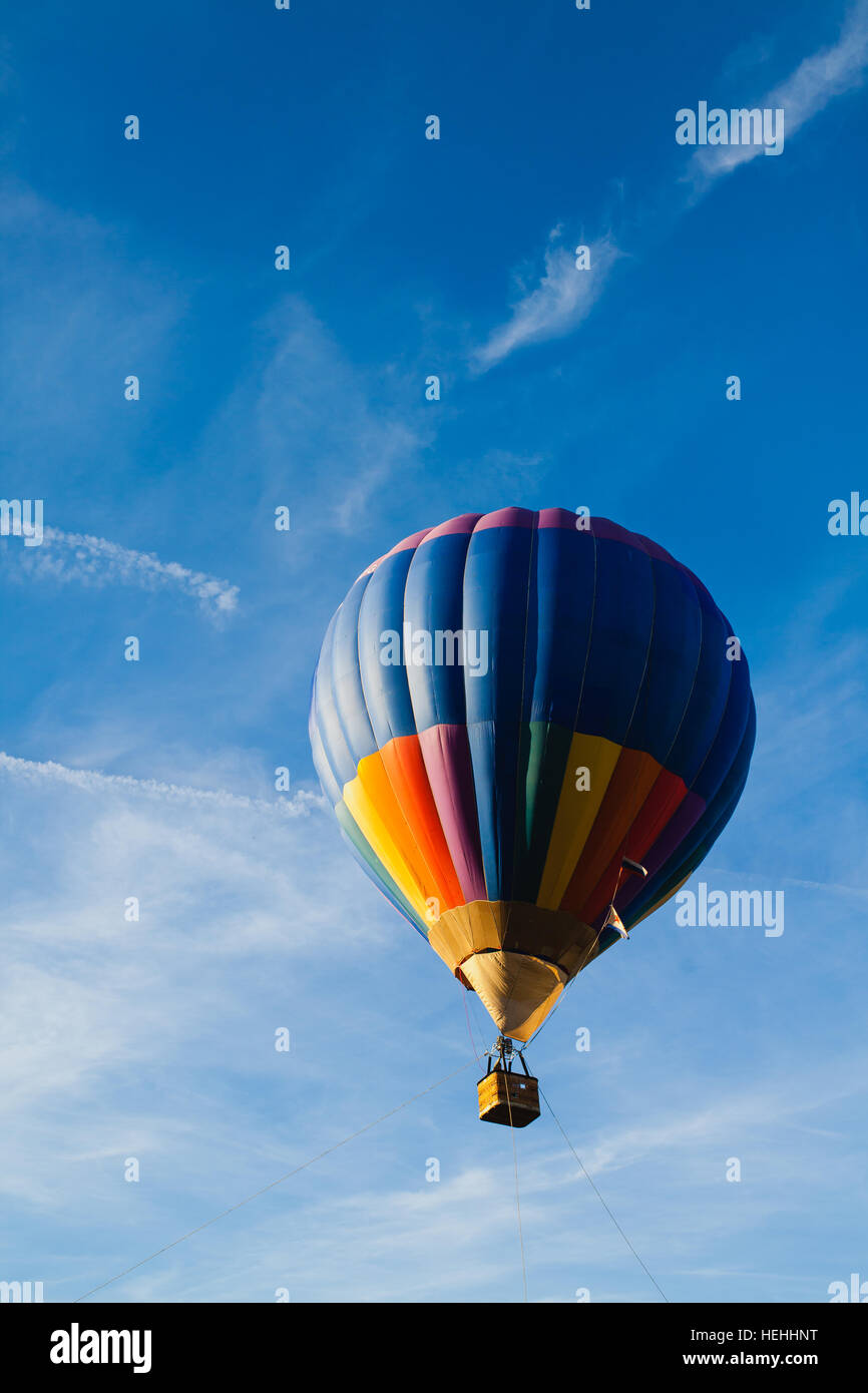 Colorful hot air balloon in blue sky at sunset Stock Photo - Alamy