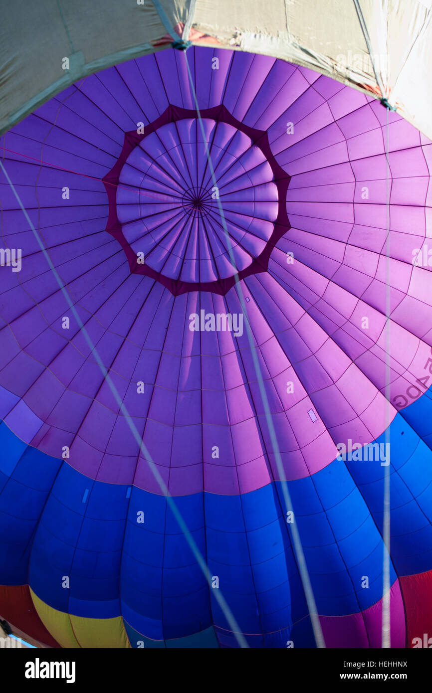 Colorful hot air balloon in blue sky at sunset Stock Photo - Alamy