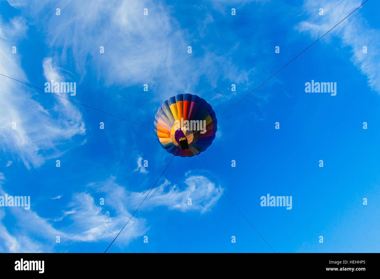 Colorful hot air balloon in blue sky at sunset Stock Photo - Alamy