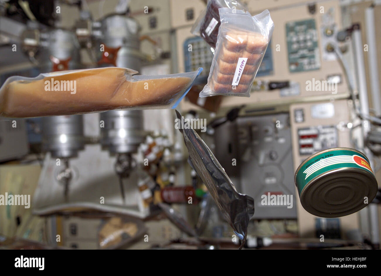 Various food containers float freely in zero gravity in the ...