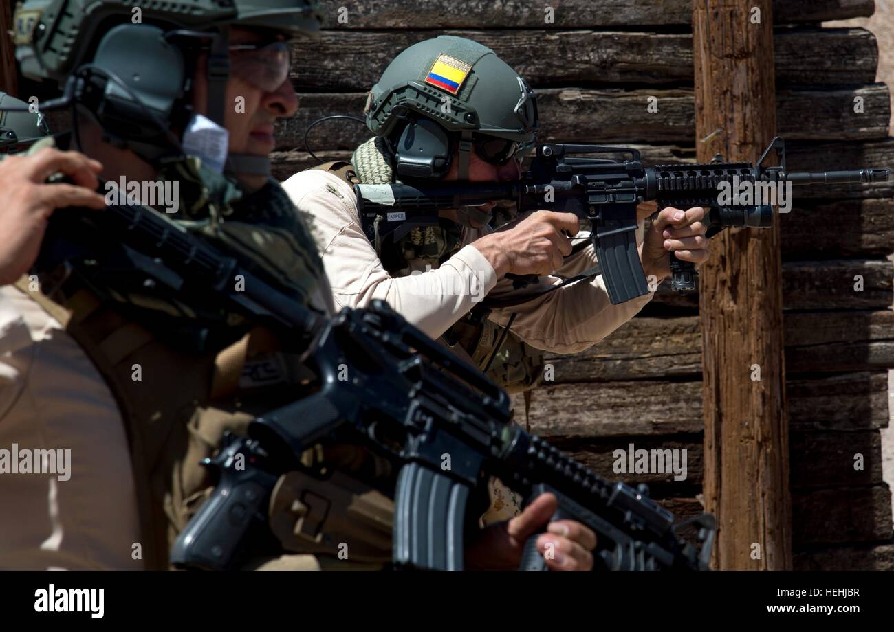 U.S. and Colombian soldiers engage a simulated target during tactical ...