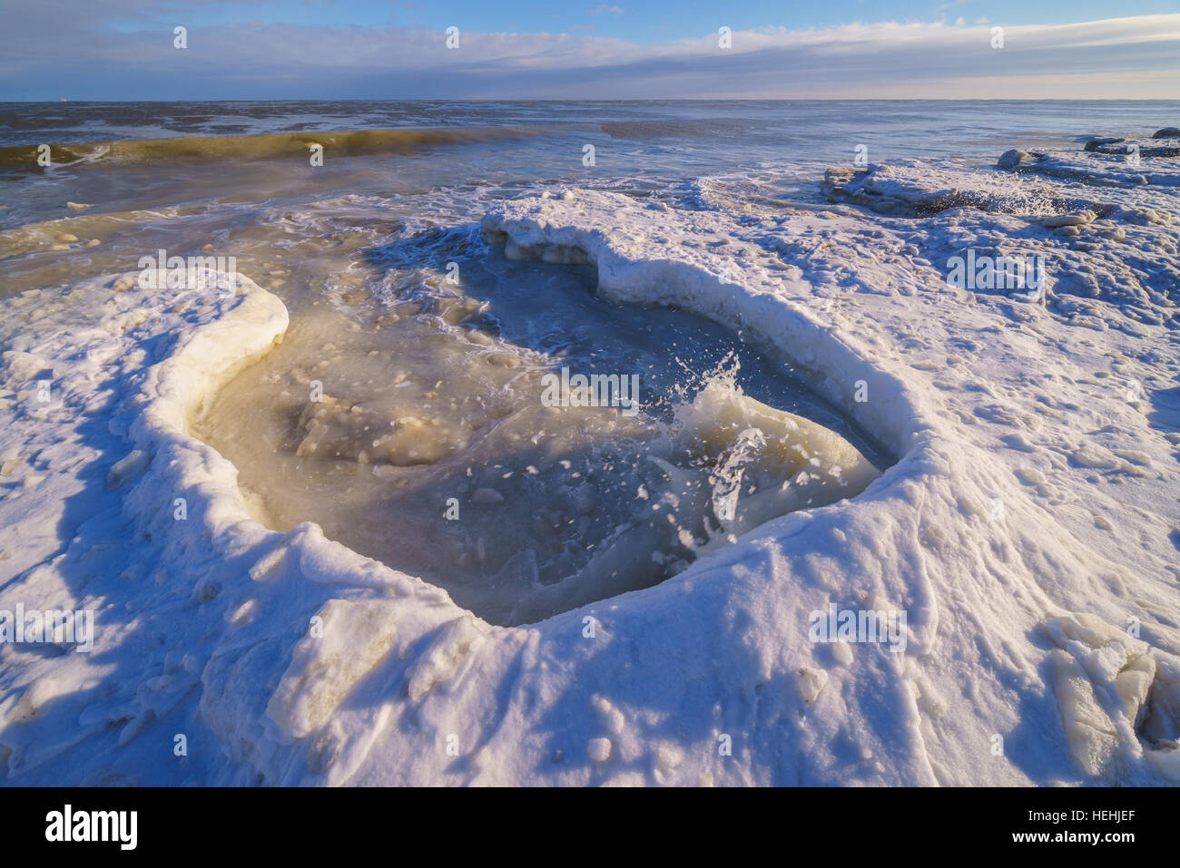 Snow crater on the seashore, Okhotsk, sakhalin island Stock Photo - Alamy