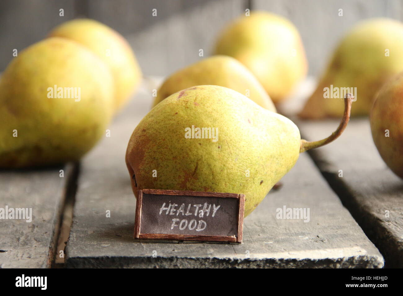 healthy food - tag with an inscription and pears Stock Photo - Alamy