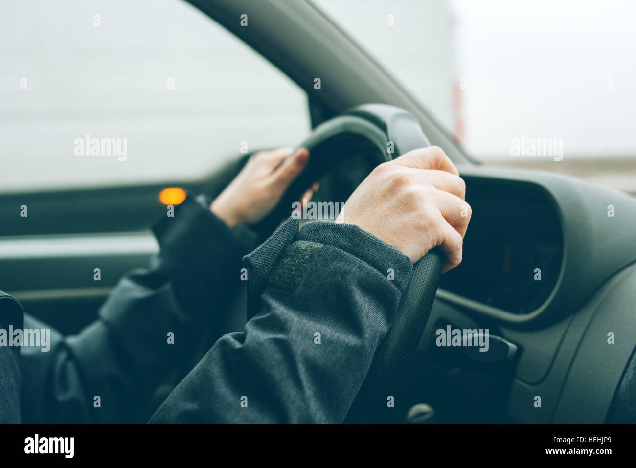 Driving hands on steering wheel hi-res stock photography and images - Alamy
