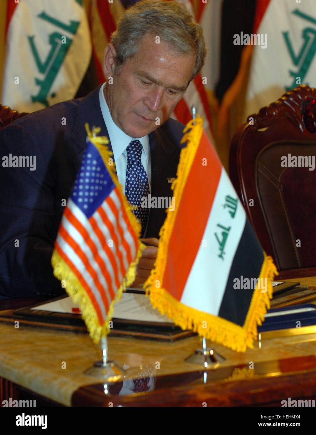 U.S. President George W. Bush signed diplomatic documents in Baghdad ...