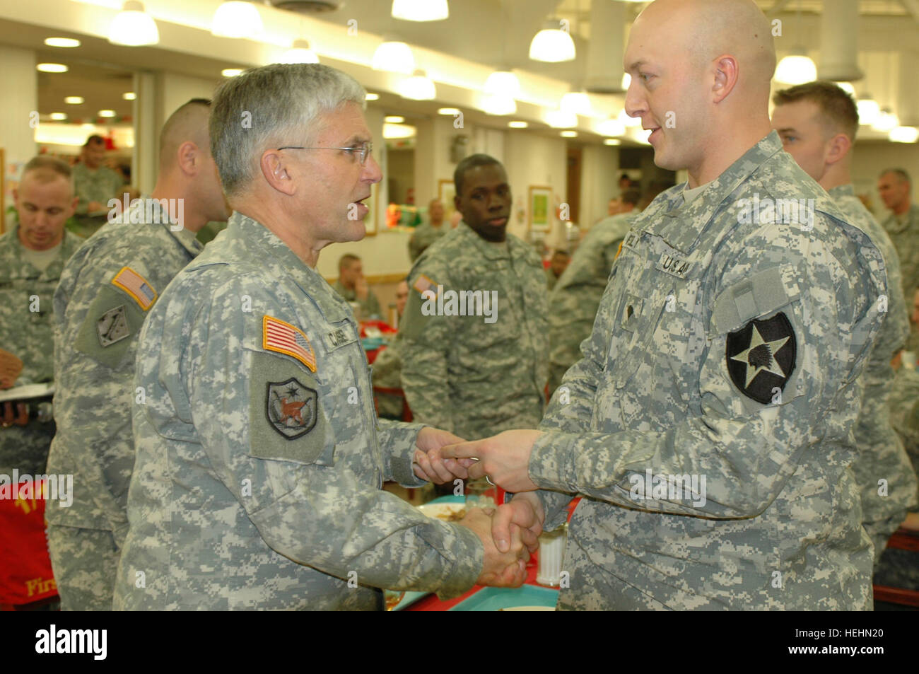 Gen. George W. Casey Jr., chief of staff of the Army, hands his coin to ...