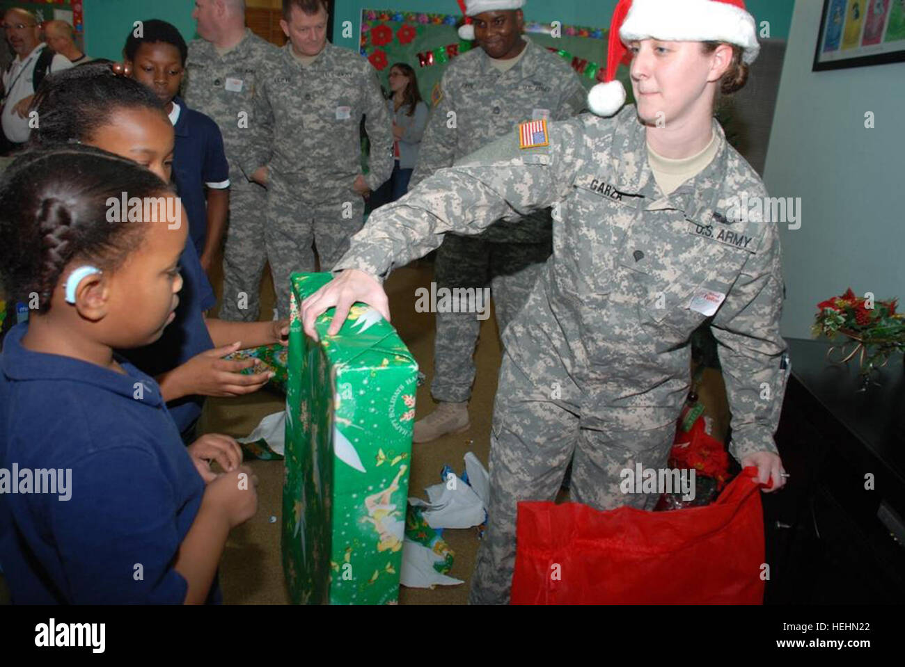 U.S. Army personnel distribute toys to children at the Louisiana School ...