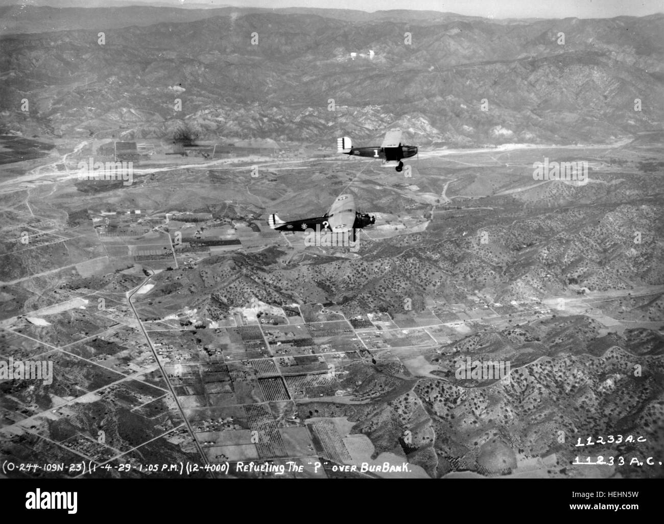 A Fokker C-2A aircraft is refueled in flight by a modified Douglas C-1 ...