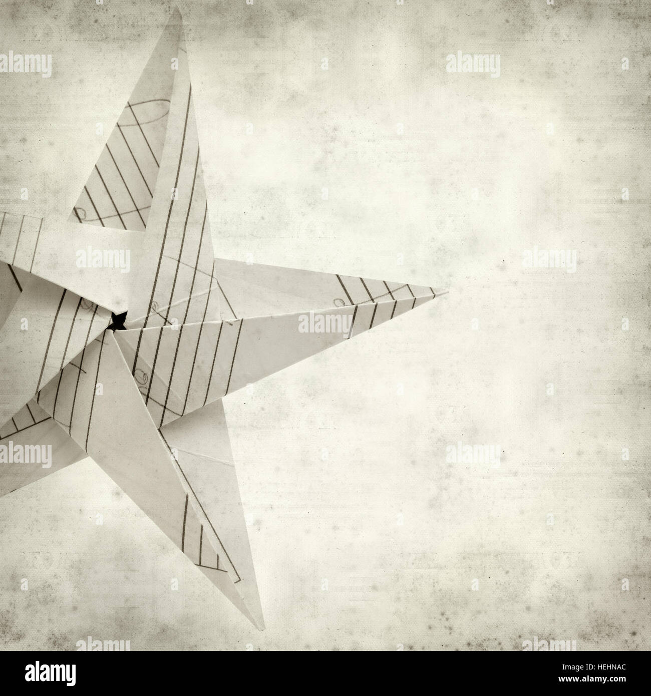 textured old paper background with folded paper star Stock Photo - Alamy