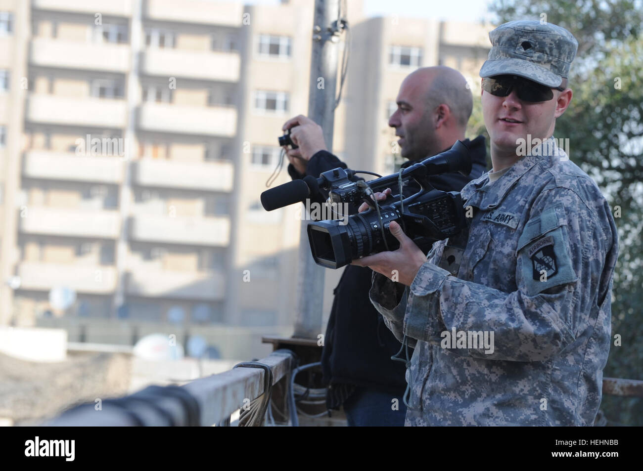U.S.Army Spc. Joshua Lowery (right) of the 982nd Combat Camera Company ...