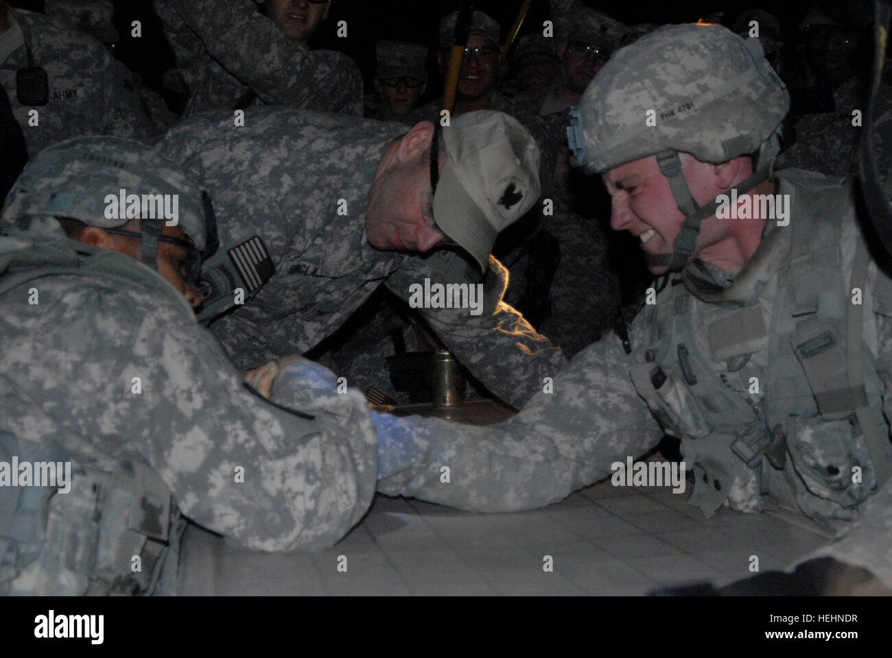 U.S. Army Col. Jeffrey Sinclair judges a round of the arm-wrestling ...