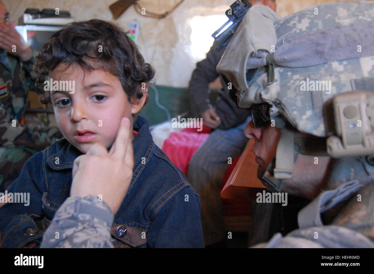 A young Iraqi boy, youngest child of a local Sons of Iraq leader ...