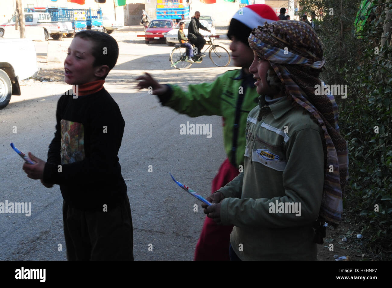 Iraqi boys from Balad, Iraq, get candy from U.S. Soldiers from ...