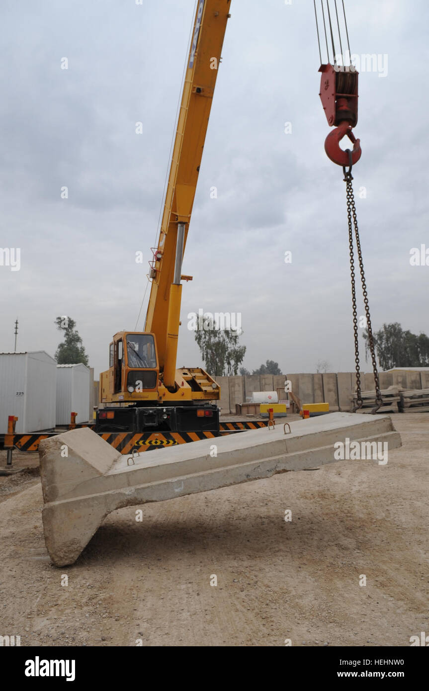 Iraqi contractor Falah Hasan from Baghdad, Iraq, helps U.S. Soldiers of ...