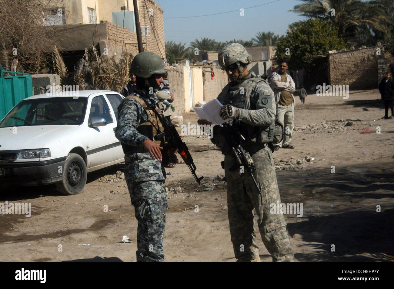 Staff Sgt. Jesus Robles, of El Paso, Texas, goes over a map, Jan. 23 ...