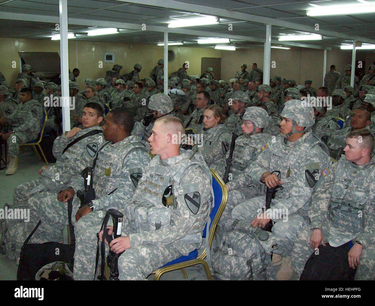 Soldiers from 2nd Brigade Combat Team, 1st Cavalry Division, sit ...